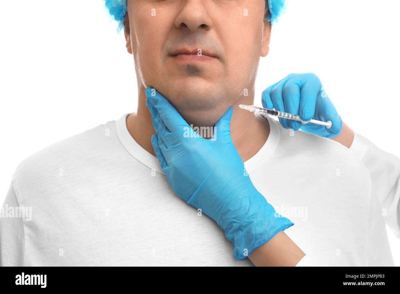 Mature man with double chin receiving injection on white background ...
