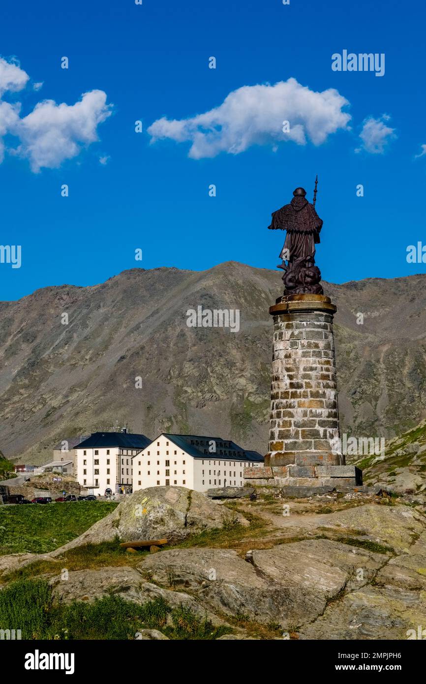 The statue of St. Bernard, buildings and alpine scenery on top of the ...