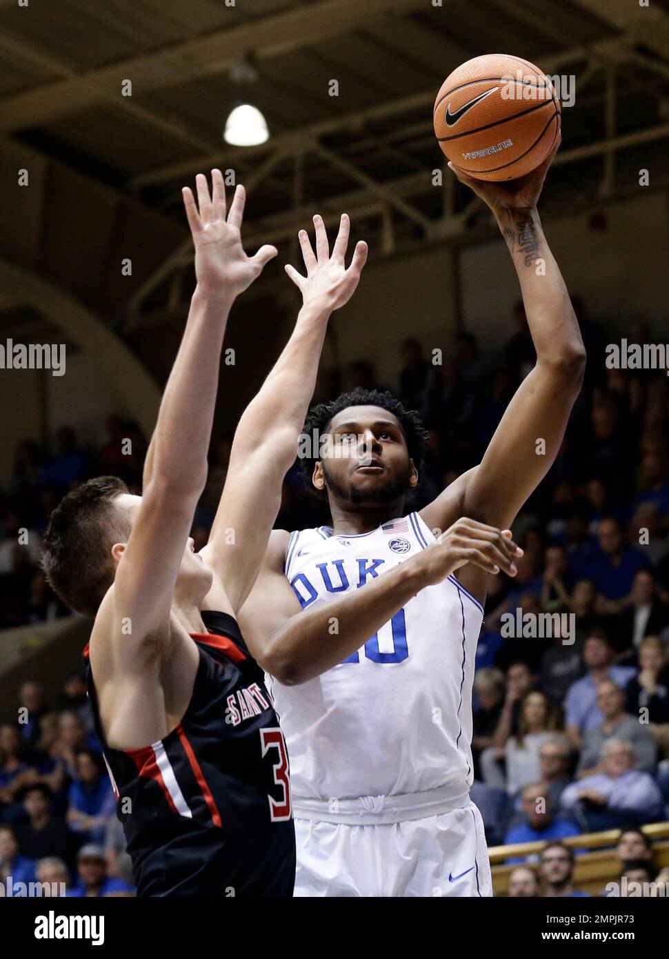 Duke's Marques Bolden (20) drives to the basket during the first half ...