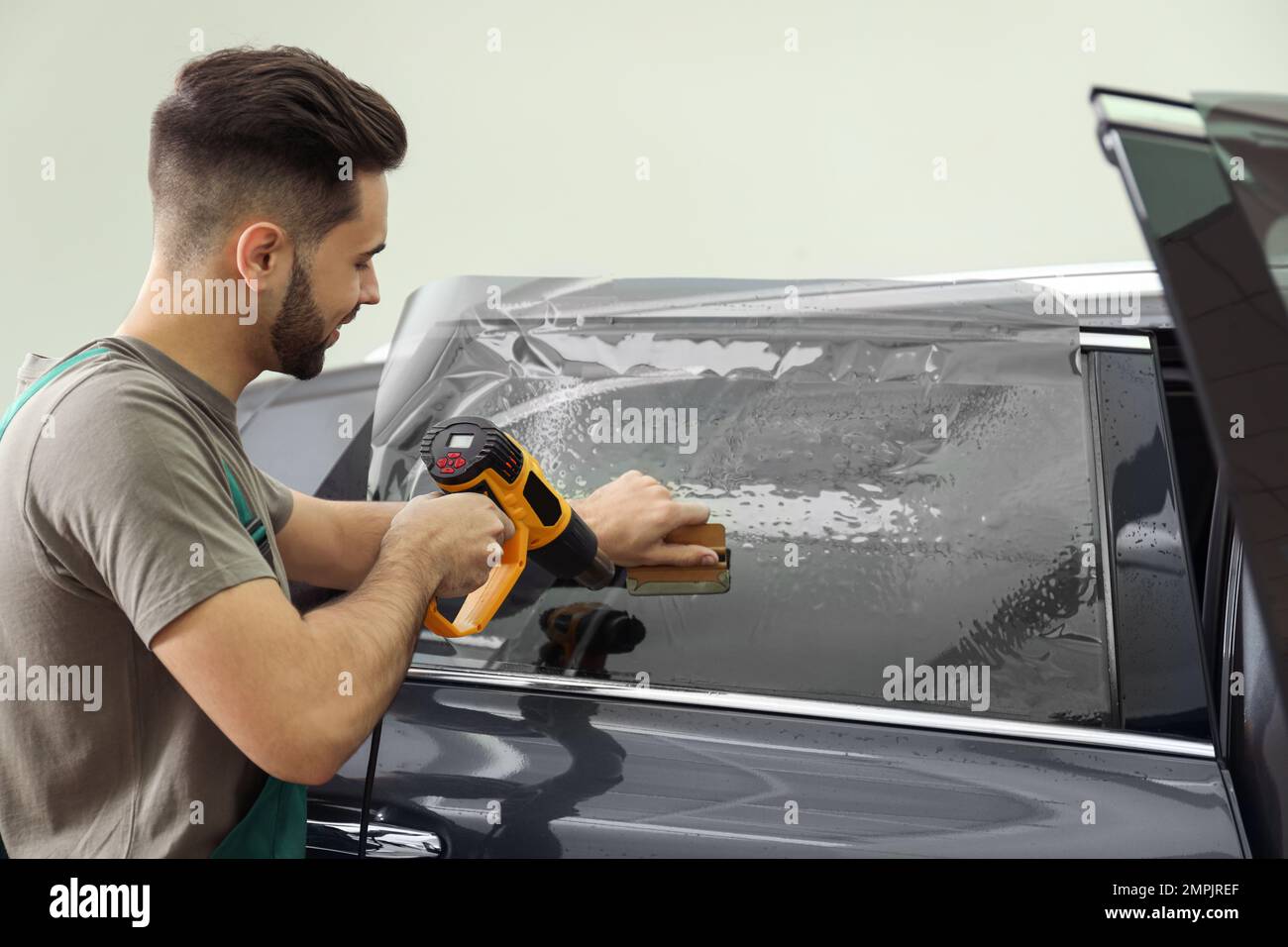 Heat gun window tinting hi-res stock photography and images - Alamy
