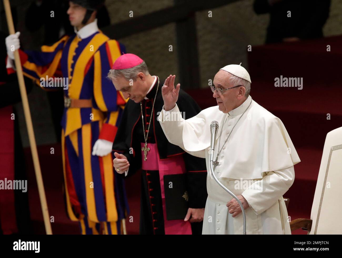 Pope Francis, flanked by Archbishop Georg Gaenswein, delivers his ...