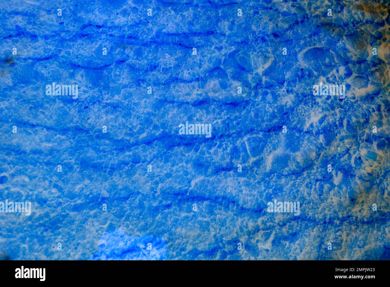 Abstract photo of neon blue glow of transparent clear water with waves ...