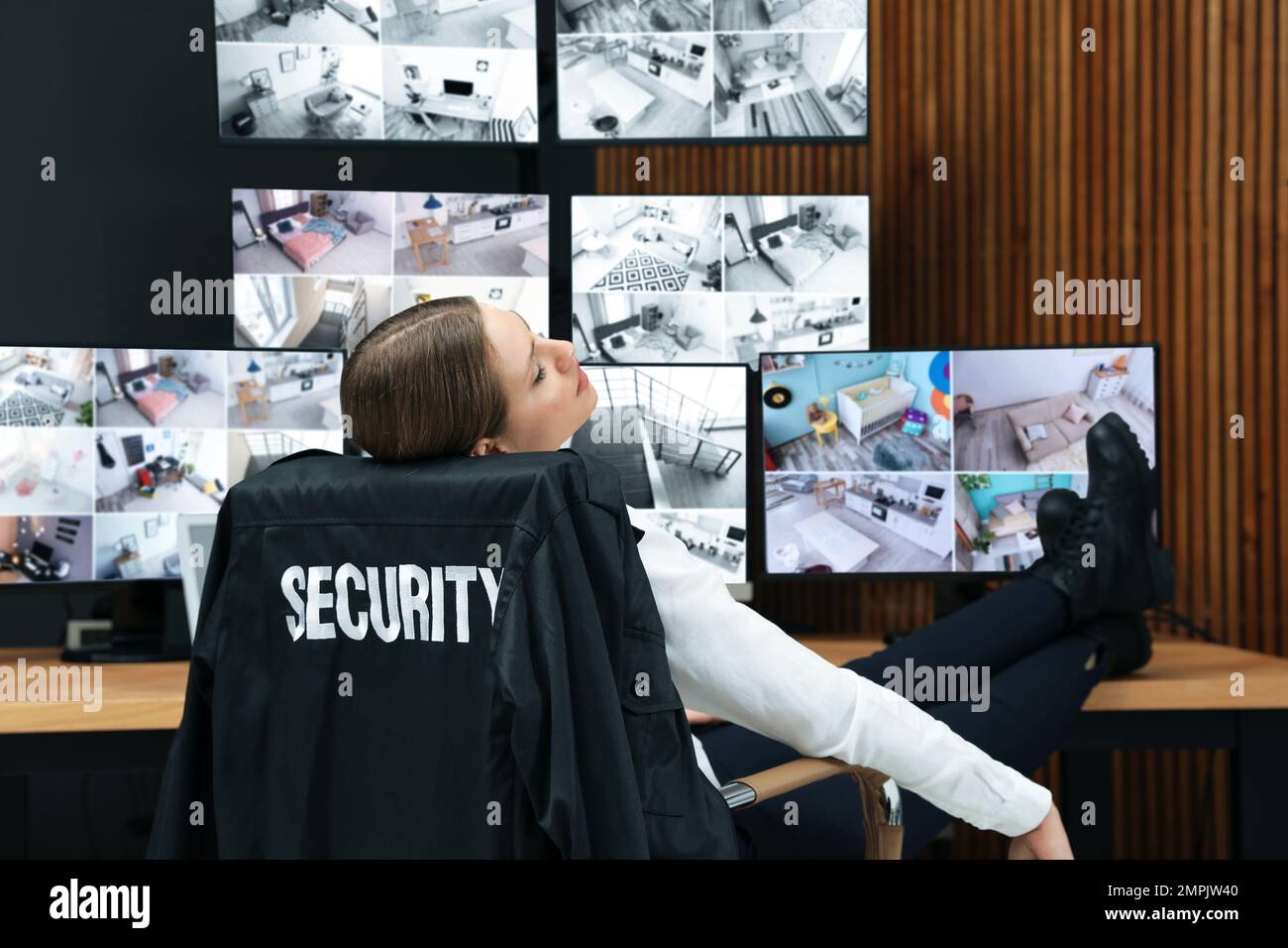 Tired security guard sleeping at workplace in office Stock Photo - Alamy
