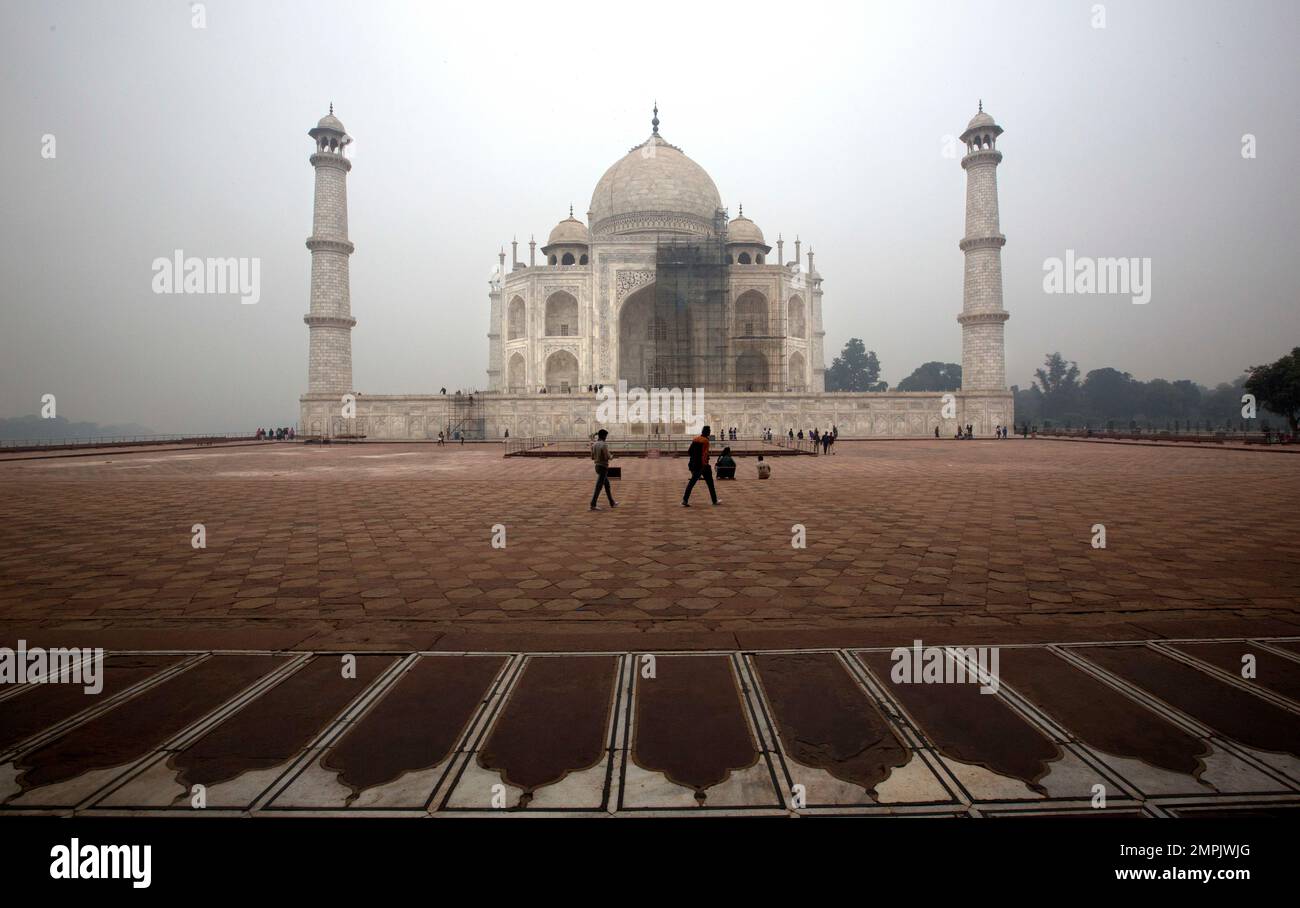 In this Tuesday, Dec. 5, 2017, photo, tourists walk around Taj Mahal as ...