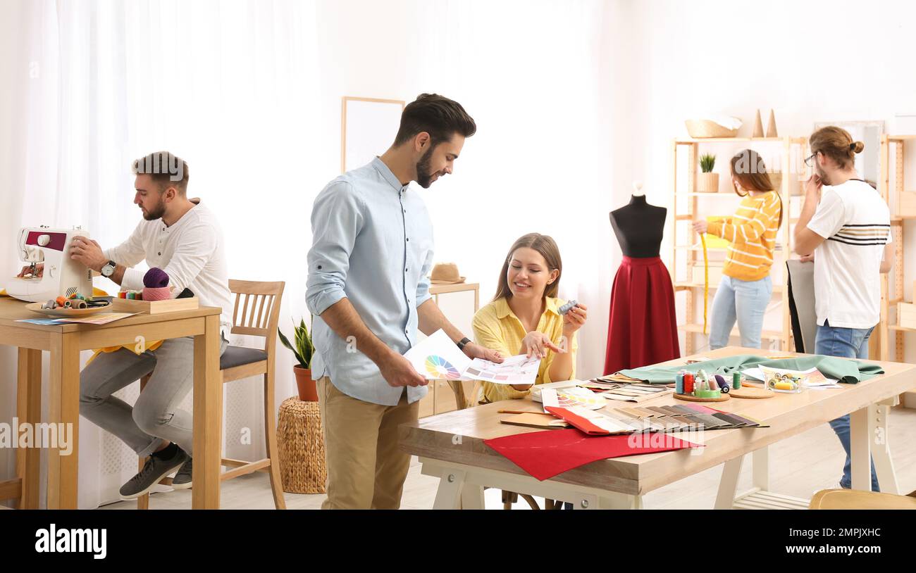 Fashion designers creating new clothes in studio Stock Photo - Alamy