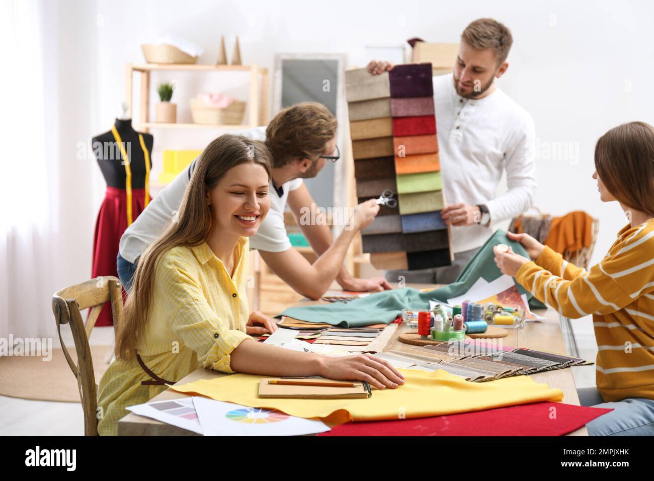Fashion designers creating new clothes in studio Stock Photo - Alamy