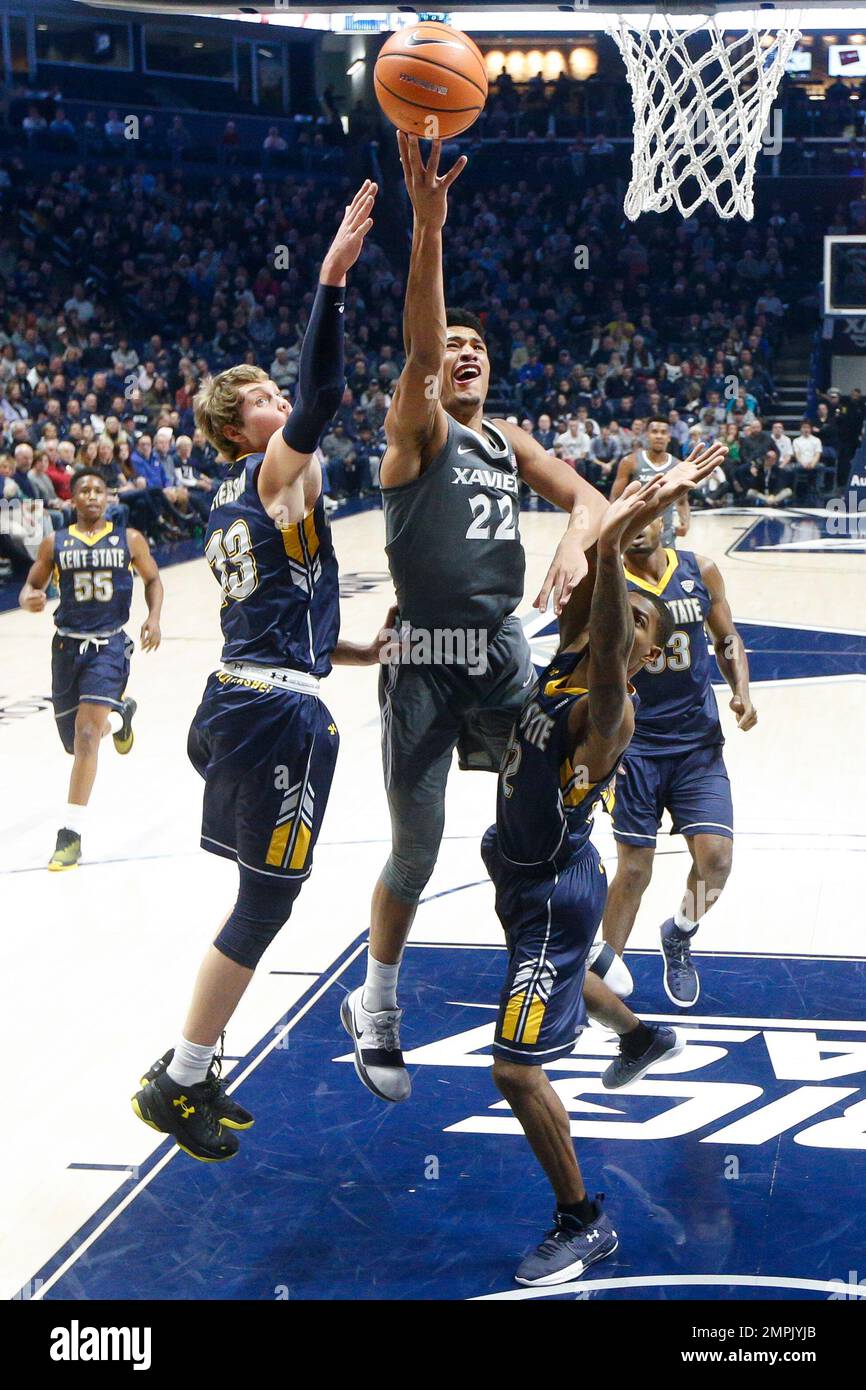 Xavier's Kaiser Gates (22) shoots against Kent State's Mitch Peterson ...