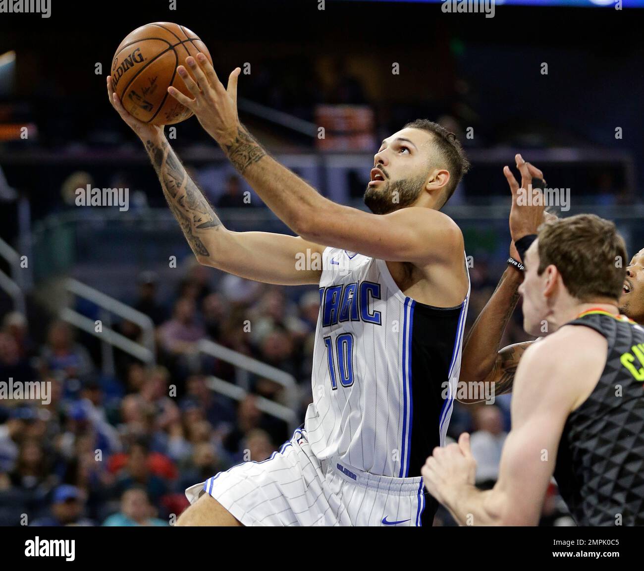 Orlando Magic's Evan Fournier (10) goes past Atlanta Hawks' Tyler ...