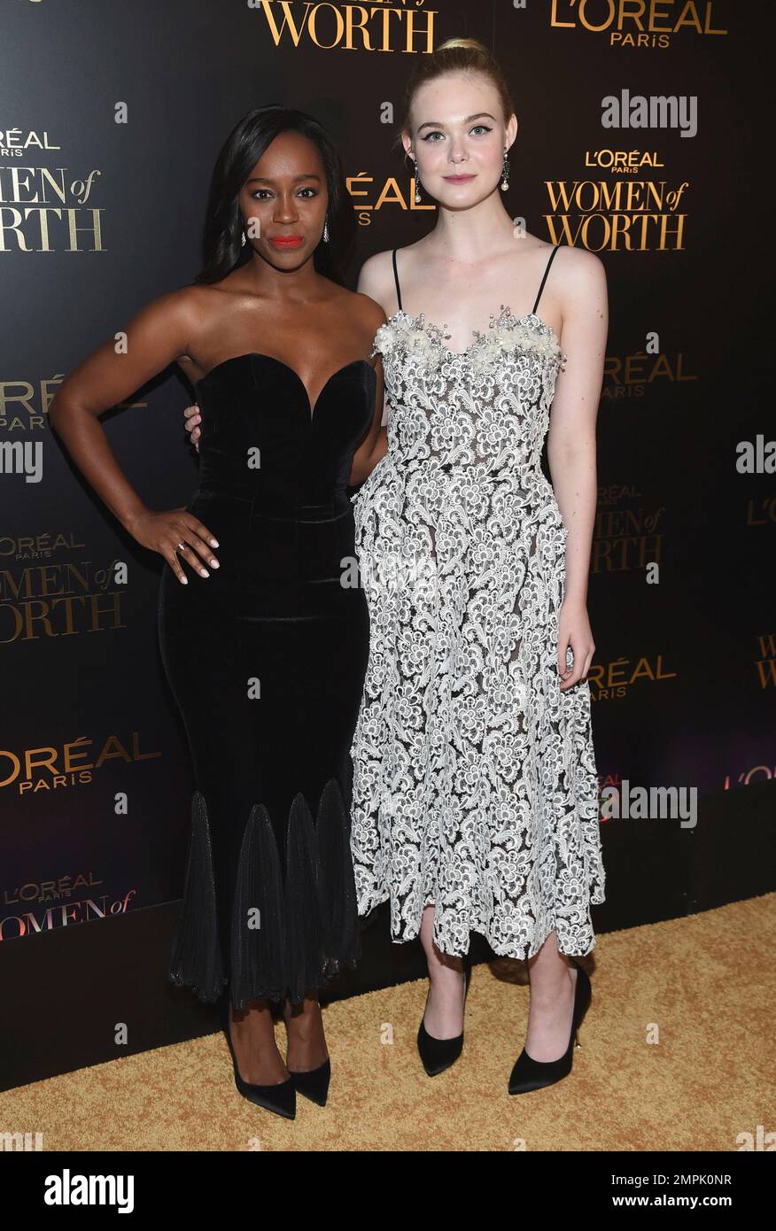 Aja Naomi King, left, and Elle Fanning attend the L'Oreal Women of ...