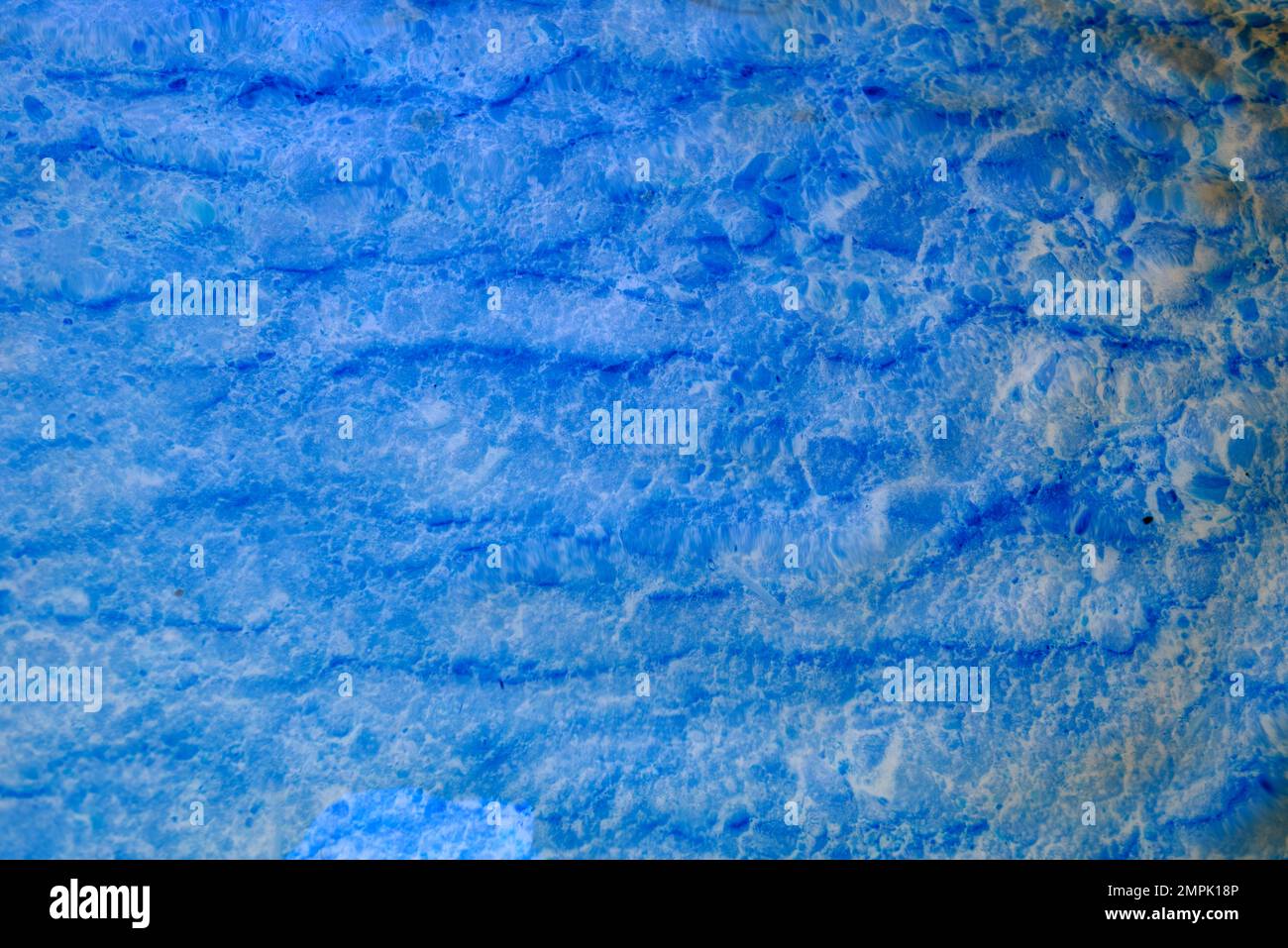 Abstract photo of neon blue glow of transparent water with waves and ...