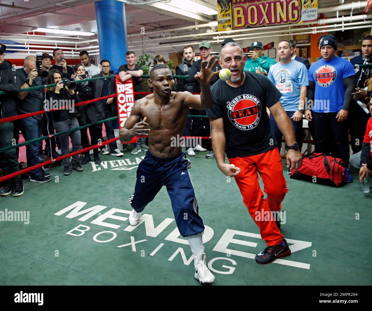 Boxer Guillermo Rigondeaux, 37, left, chases a tiny, airborne ball ...