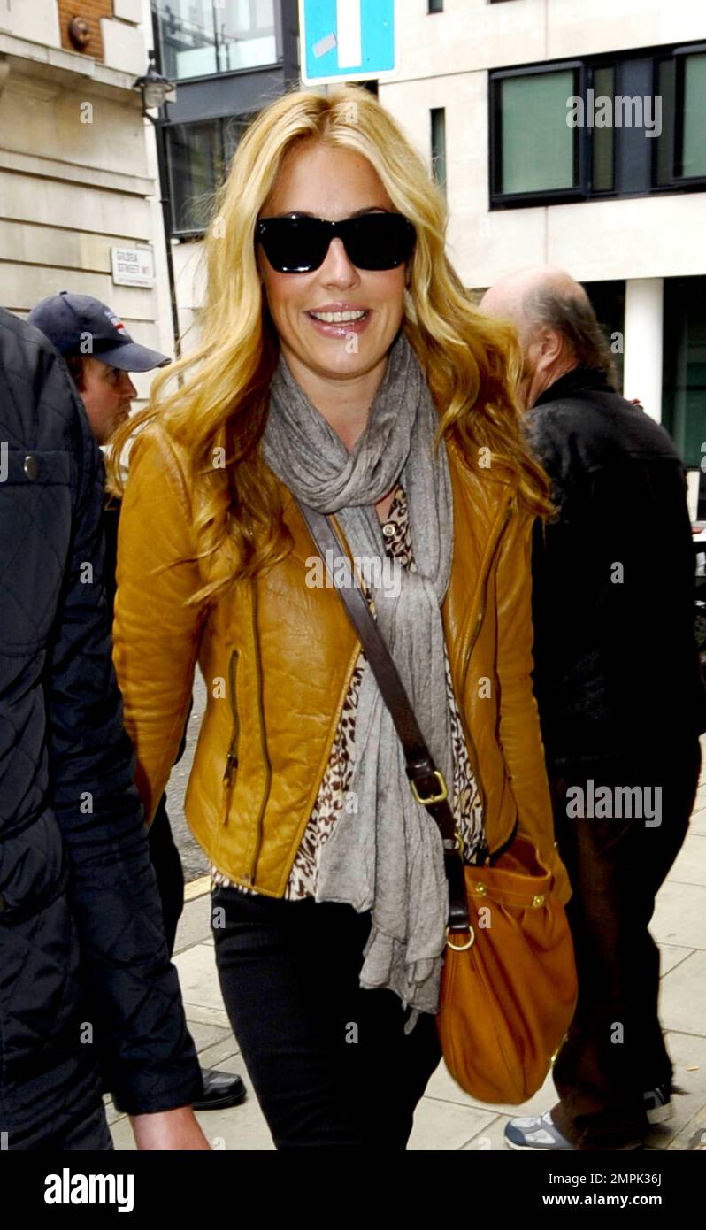 Television presenter Cat Deeley strolls with a friend in the west end ...