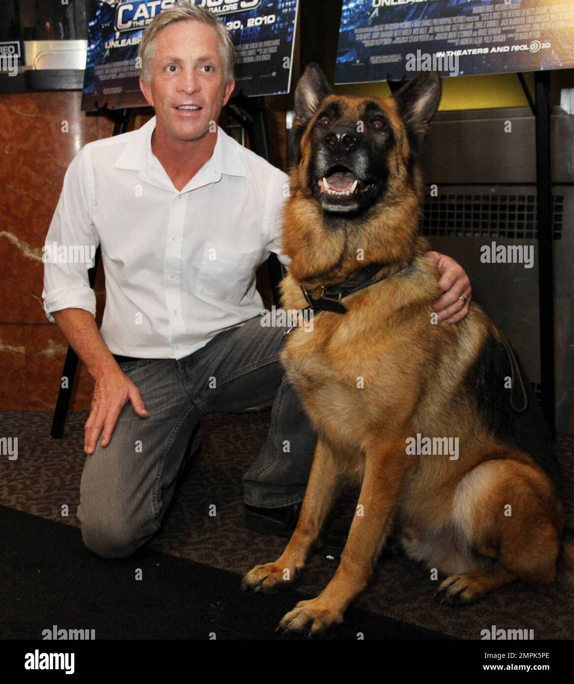 Animal trainer Mark Holden poses with German Shepherd Diggs at a ...