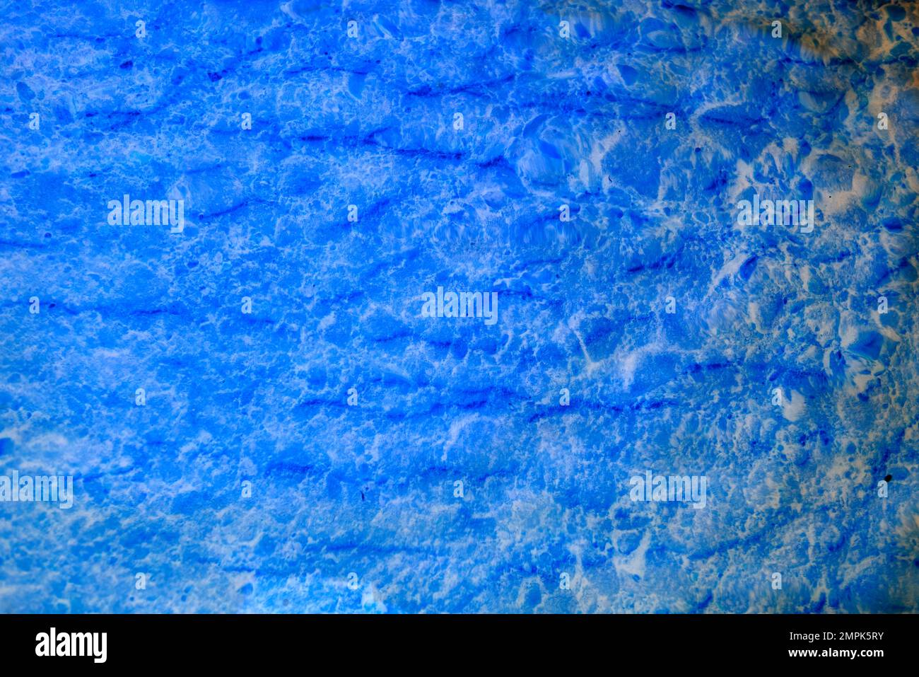 Abstract photo of neon blue glow of transparent water with waves and ...