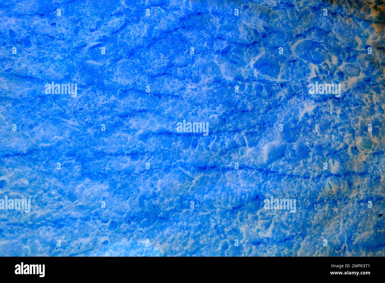 Abstract photo of neon blue glow of transparent water with waves and ...