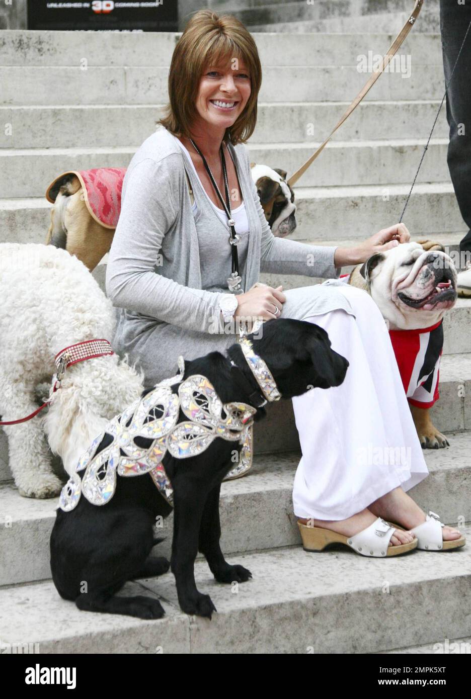 Ruth Langsford and her dog Mimi (clad in canine couture Vivienne Westwood sequin outfit) arrive ...