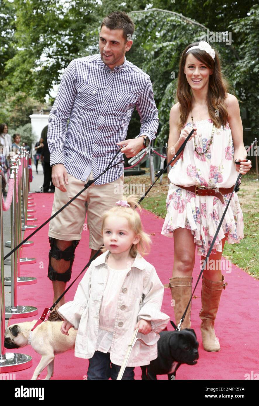 Nicola Tappenden (aka Nicola T), Simon Walton and their daughter Poppy arrive at the UK premiere ...