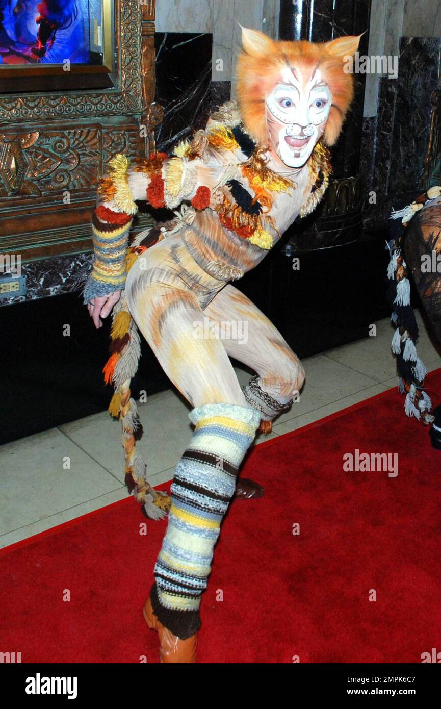 A Cats cast member arrives on the red carpet for the opening night of ...