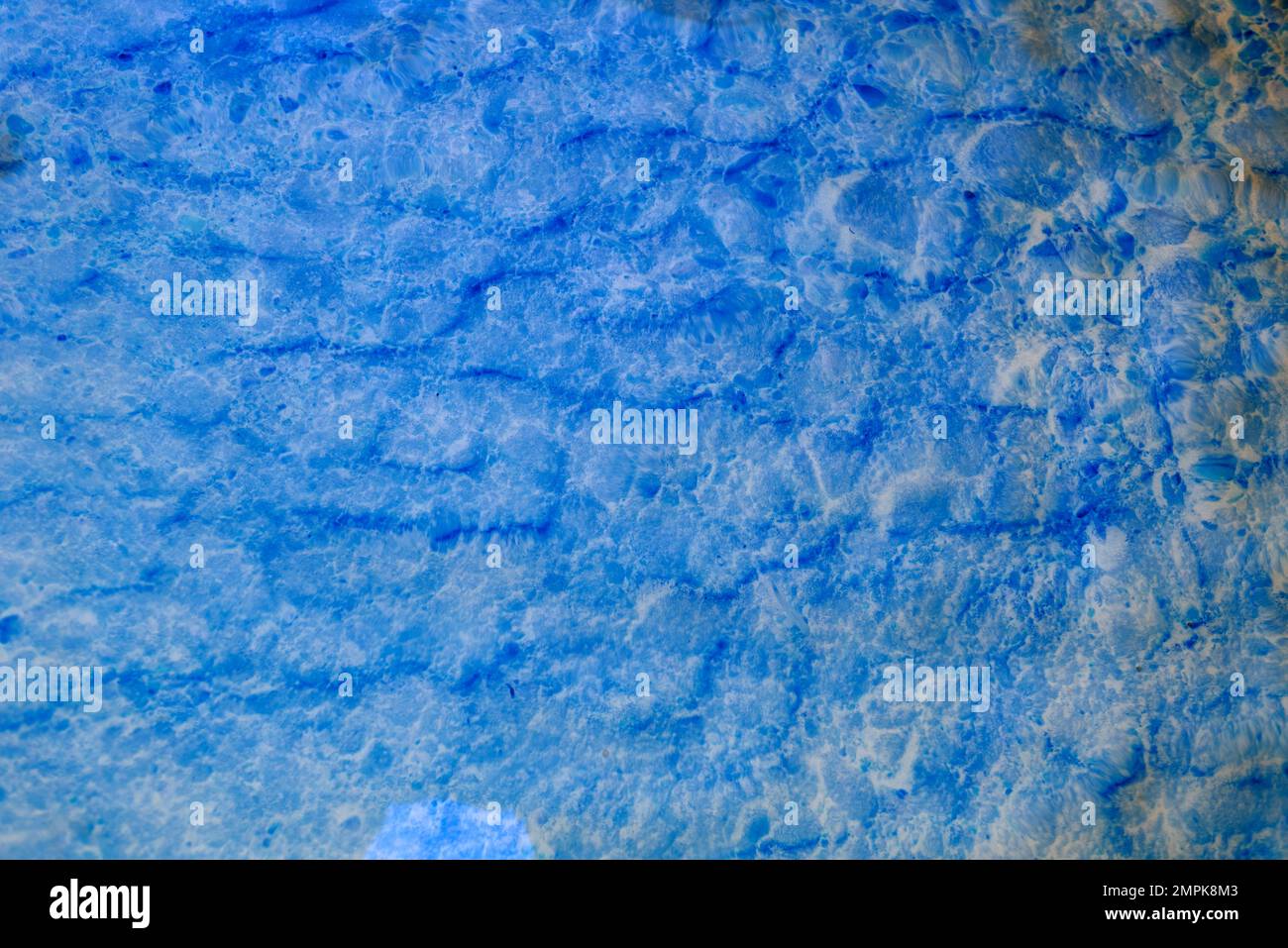 Abstract photo of glow in neon blue color of transparent water texture ...