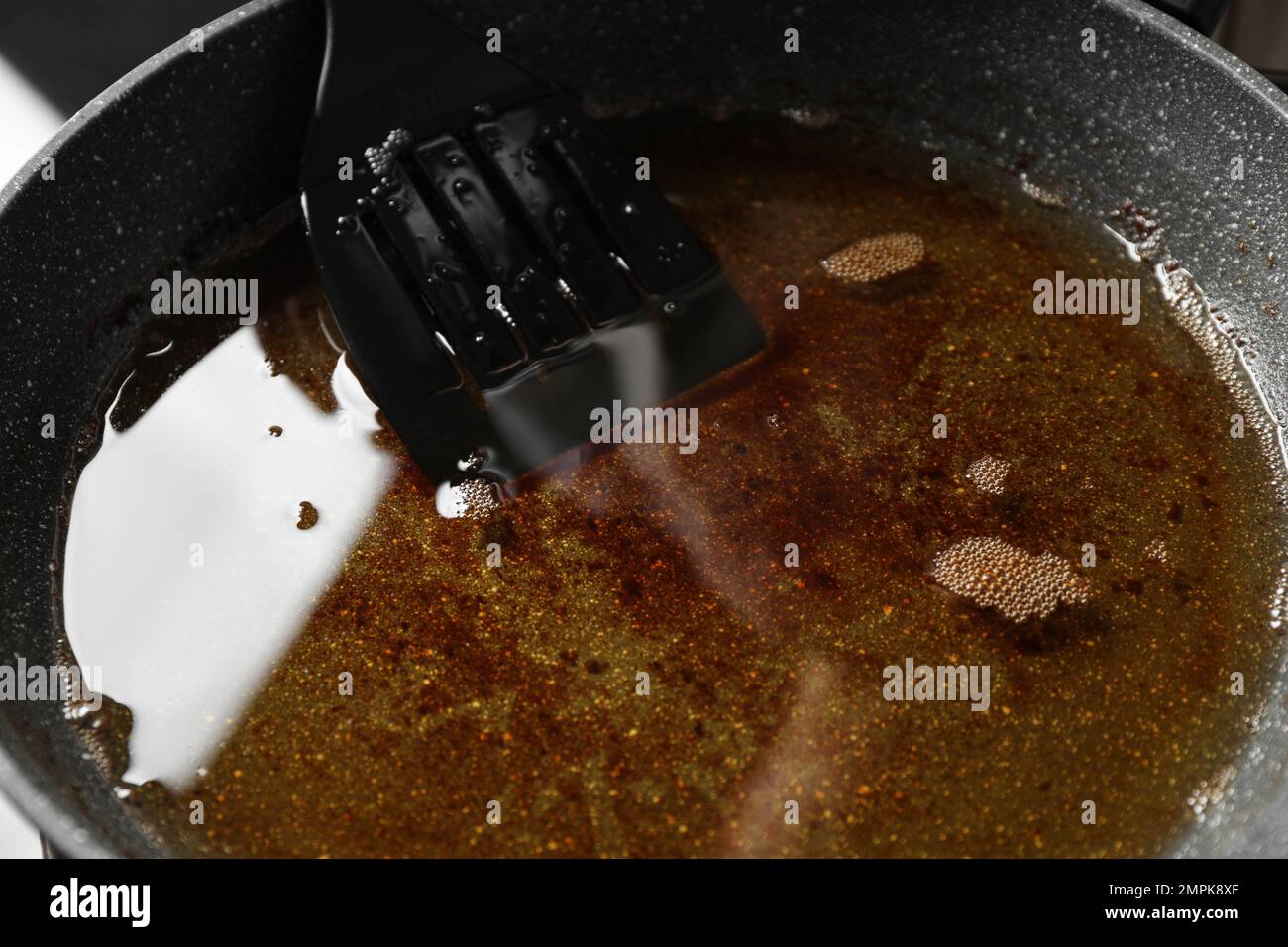 Used cooking oil in frying pan, closeup Stock Photo - Alamy