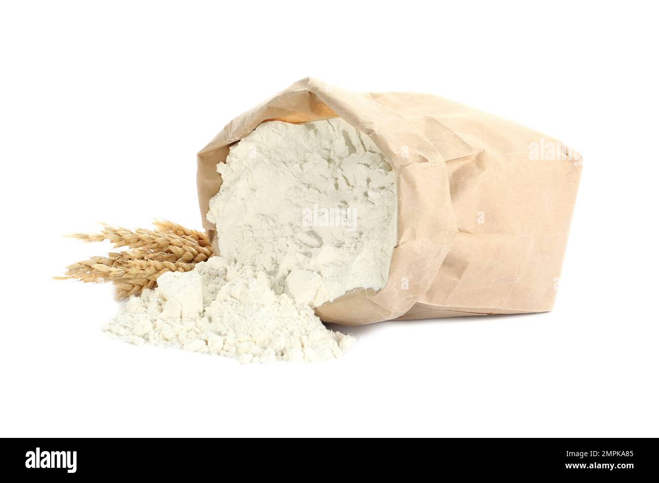 Overturned paper bag of flour and spikelets isolated on white Stock ...