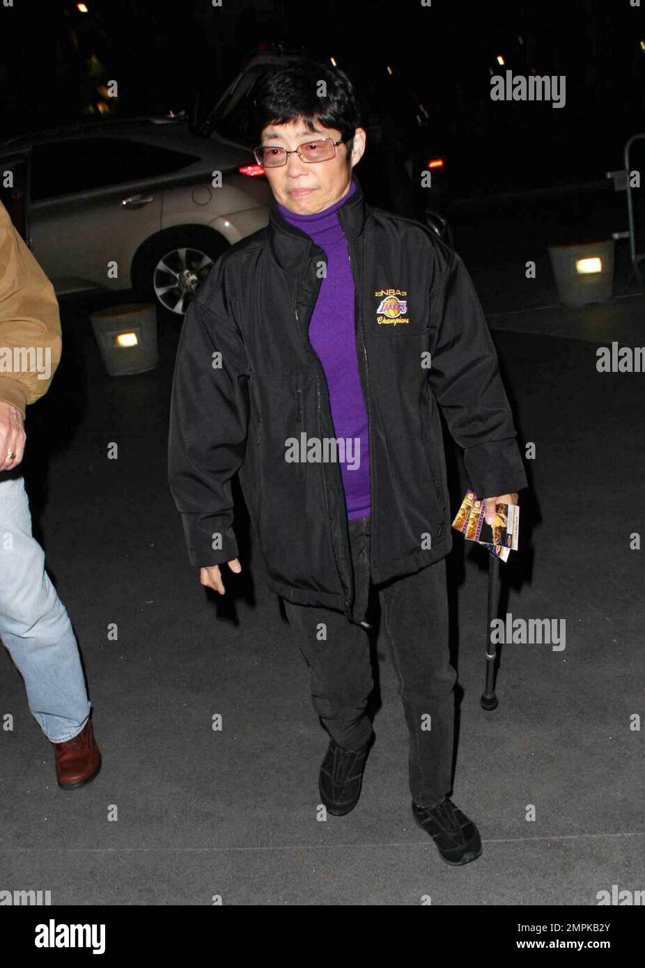 Tiger Woods' mother Kultida 'Tida' Woods uses a cane as she arrives at ...