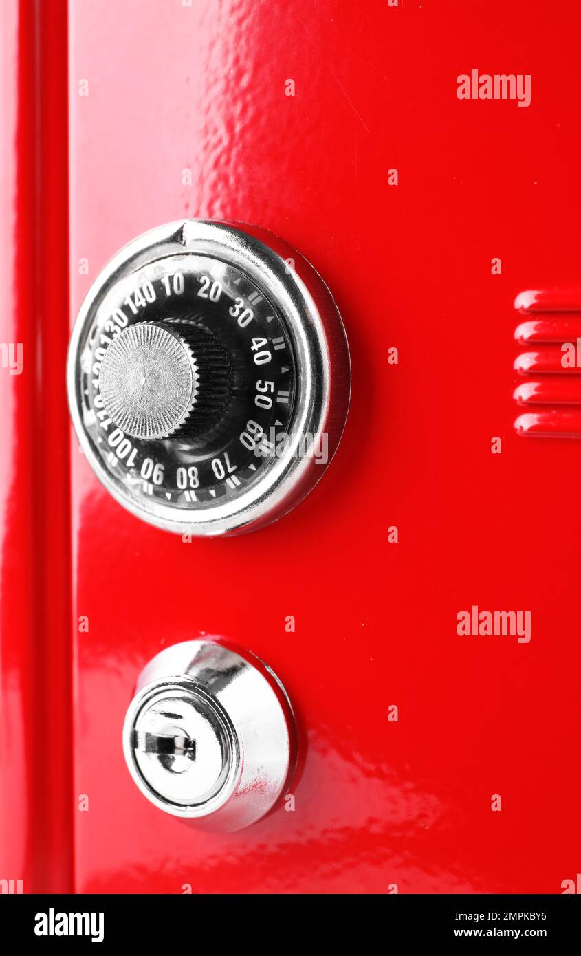 Red steel safe with mechanical combination lock, closeup Stock Photo ...