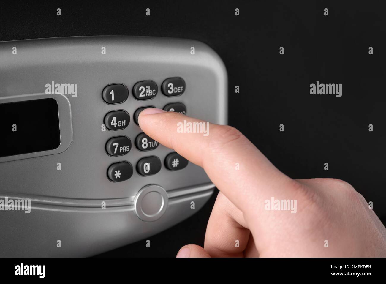 Man opening black steel safe with electronic lock, closeup Stock Photo ...