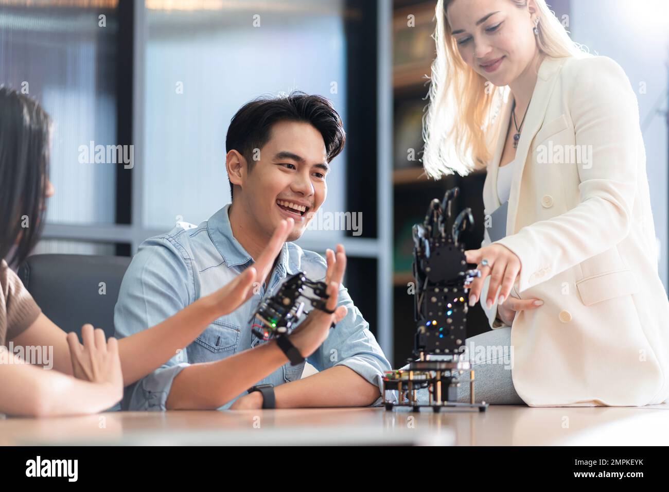 Young students researching inventions with modern technology in ...