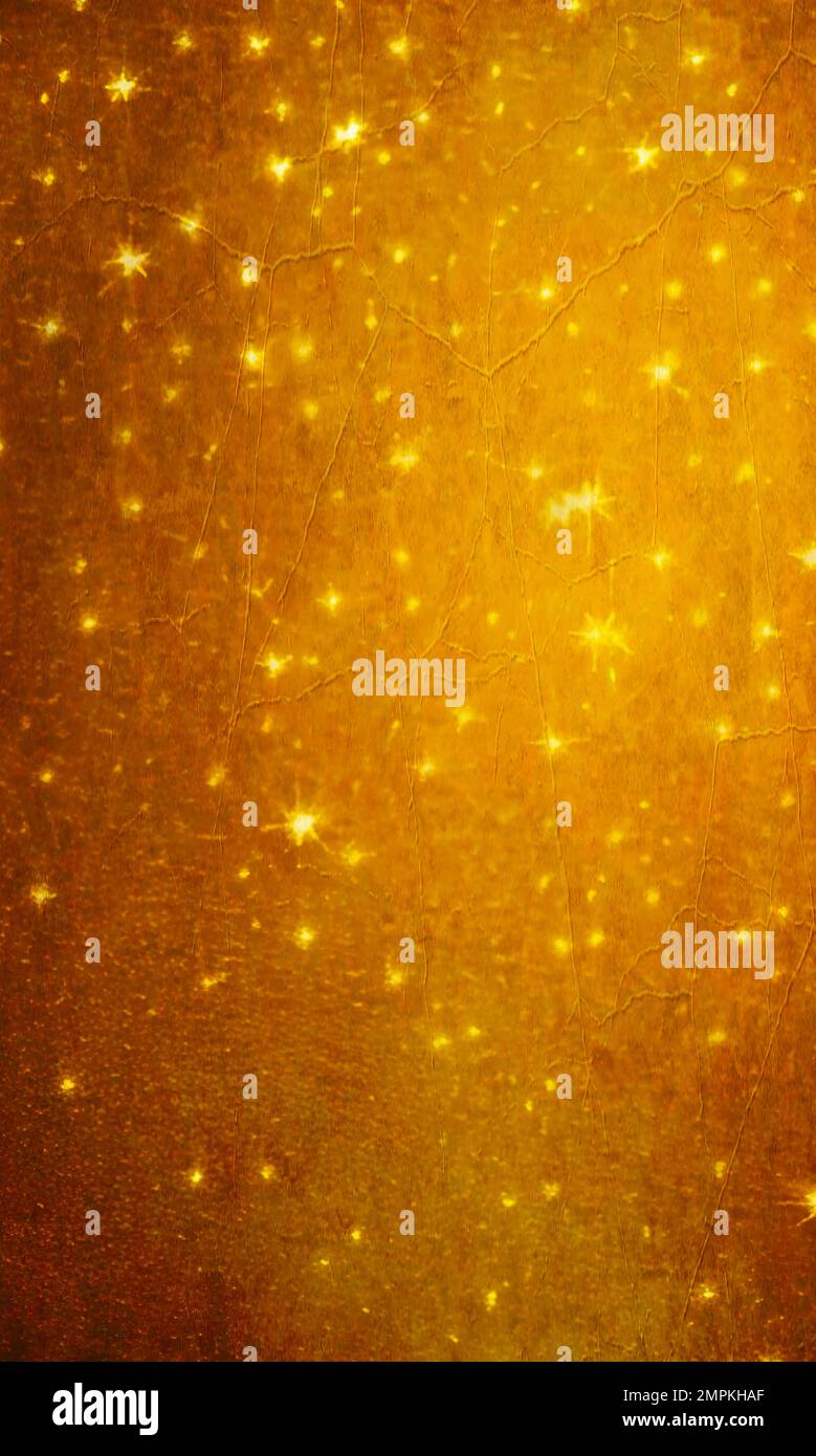 A vertical shot of a gold color background with vintage and old photo ...