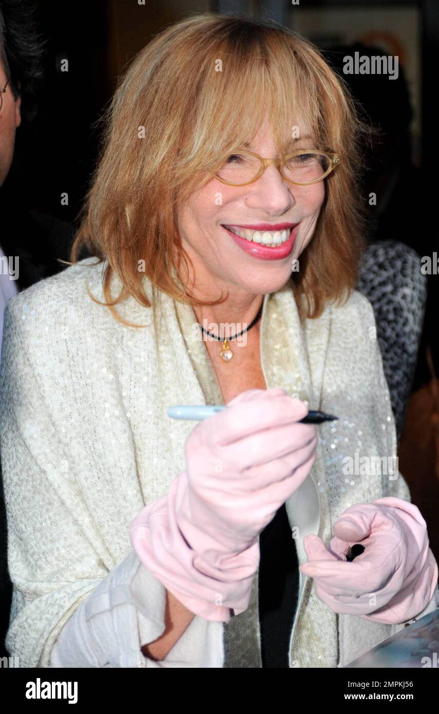 Singer/songwriter Carly Simon signs autographs as she leaves the BBC ...