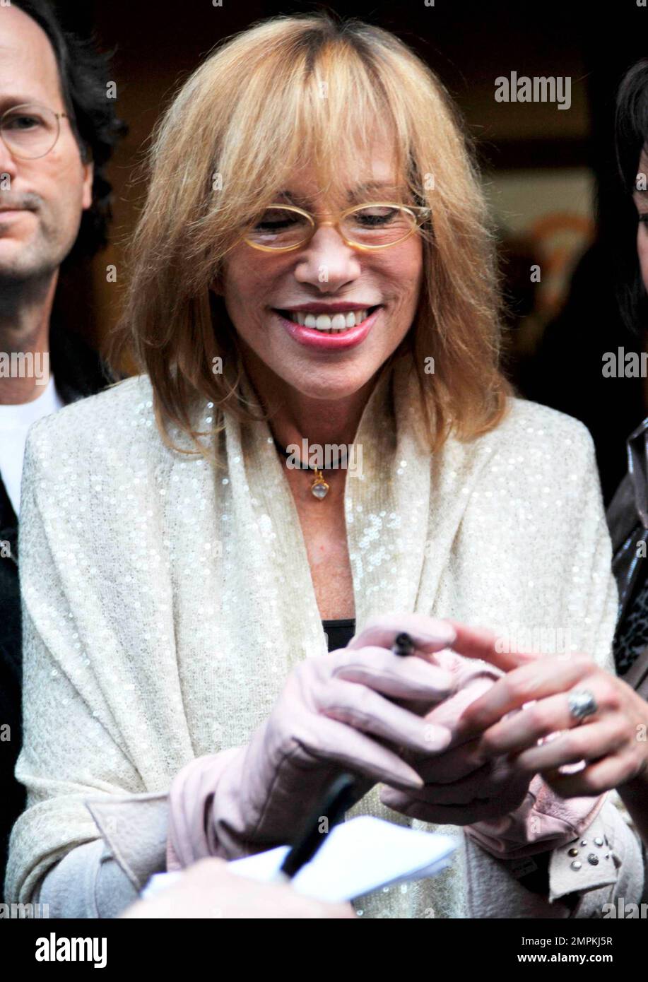Singer/songwriter Carly Simon signs autographs as she leaves the BBC ...