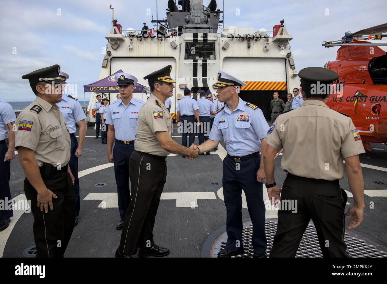 Capt. Timothy Brown, center, commanding officer of the U.S. Coast Guard ...