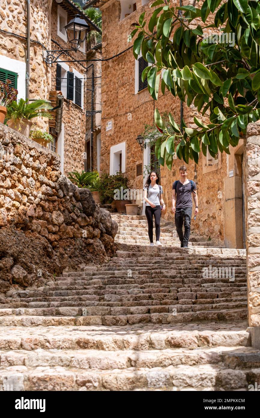 couple in typical street, Fornalutx, Soller valley route, Mallorca ...
