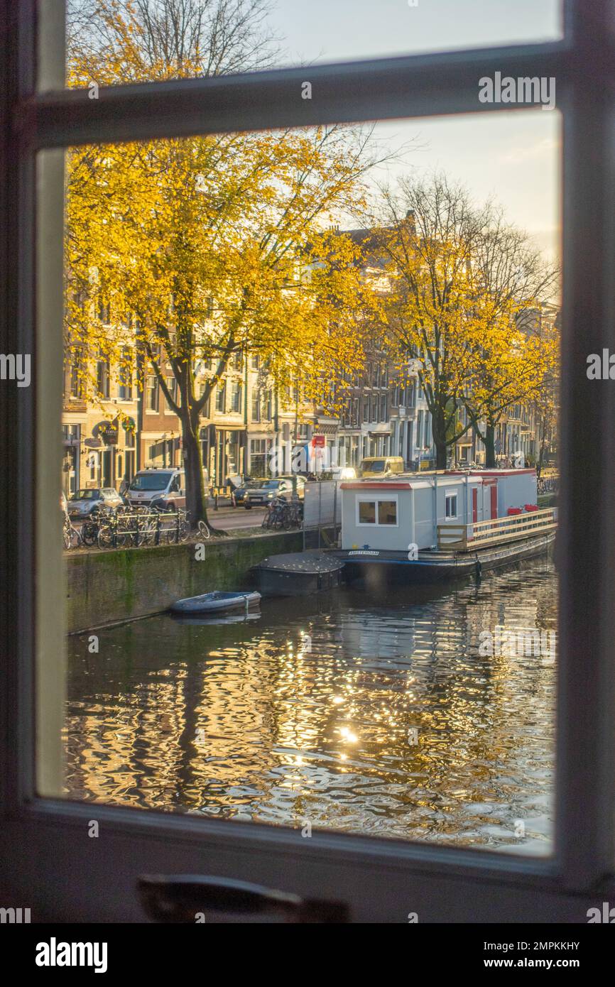 Looking through window south along the Geldersekade canal, Amsterdam ...