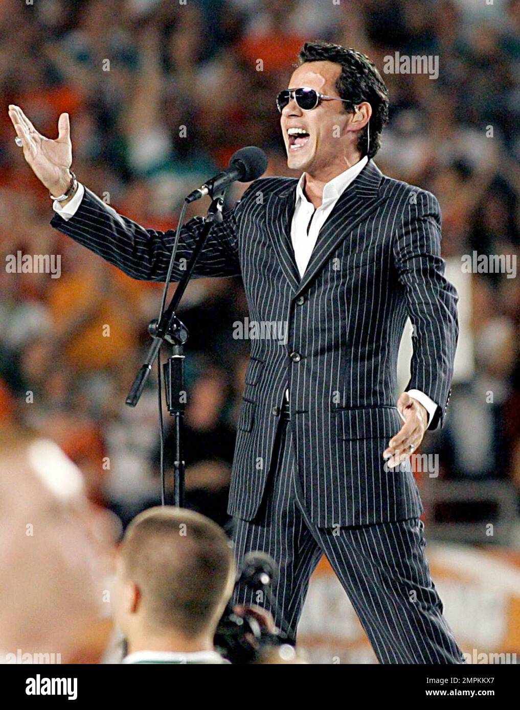 Marc Anthony performs the National Anthem prior to the start of the ...