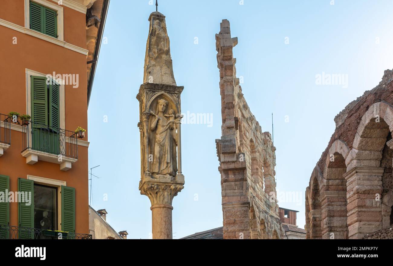 ancient gothic votive shrine depicting the Madonna and Saints in Piazza ...