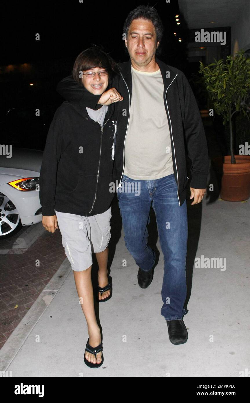 Actor Ray Romano goofs around with his son Joseph as they arrive at ...