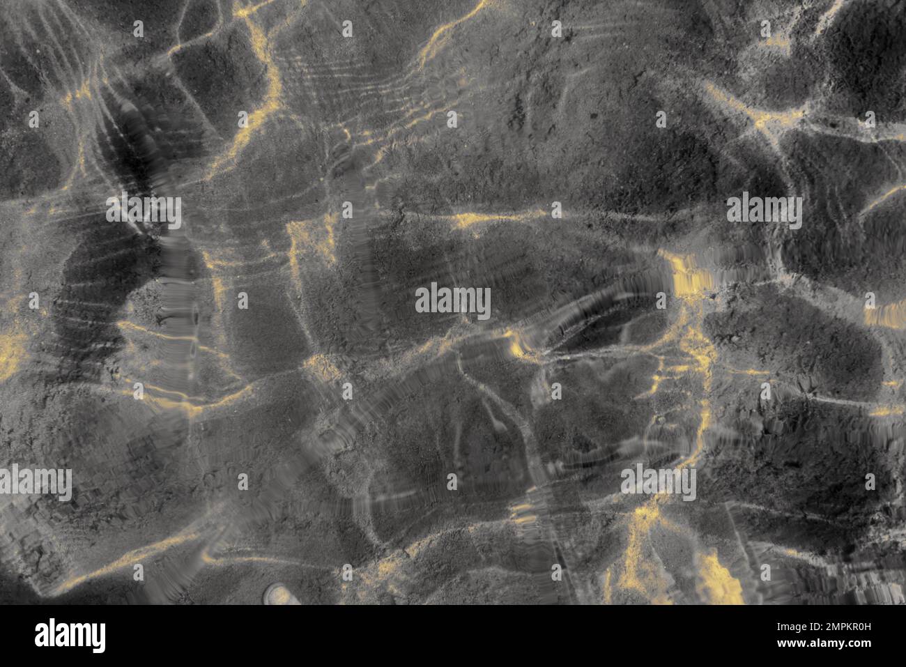 Abstract photo of the glow of the surface of transparent water. The ...
