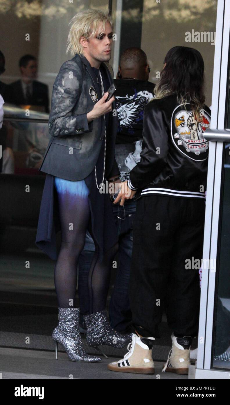 In flashy spandex and glittery high heeled boots Justin Tranter, lead ...