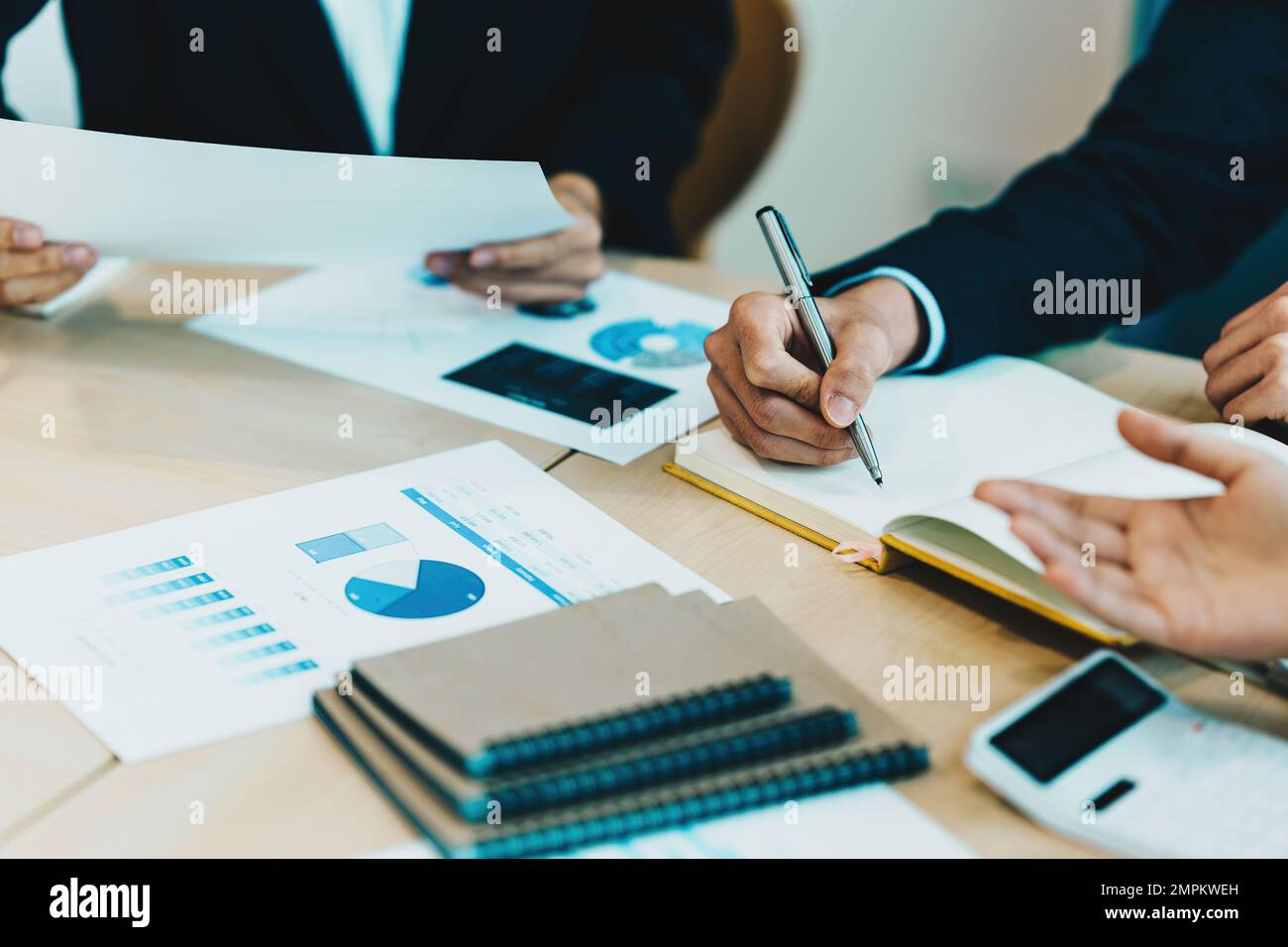 Group of business team offer the new project together in the meeting ...