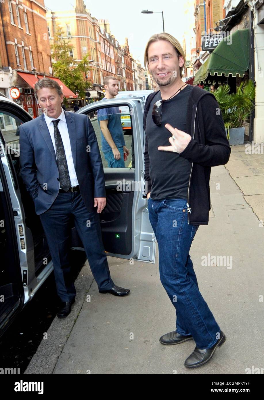 Nickelback singer Chad Kroeger smiles as he leaves a recording studio ...