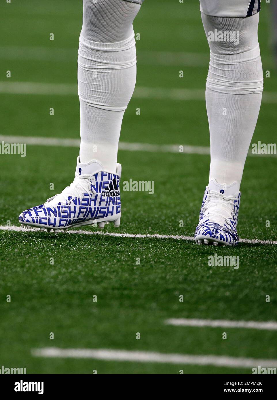 The cleats of Dallas Cowboys quarterback Dak Prescott are shown as he ...