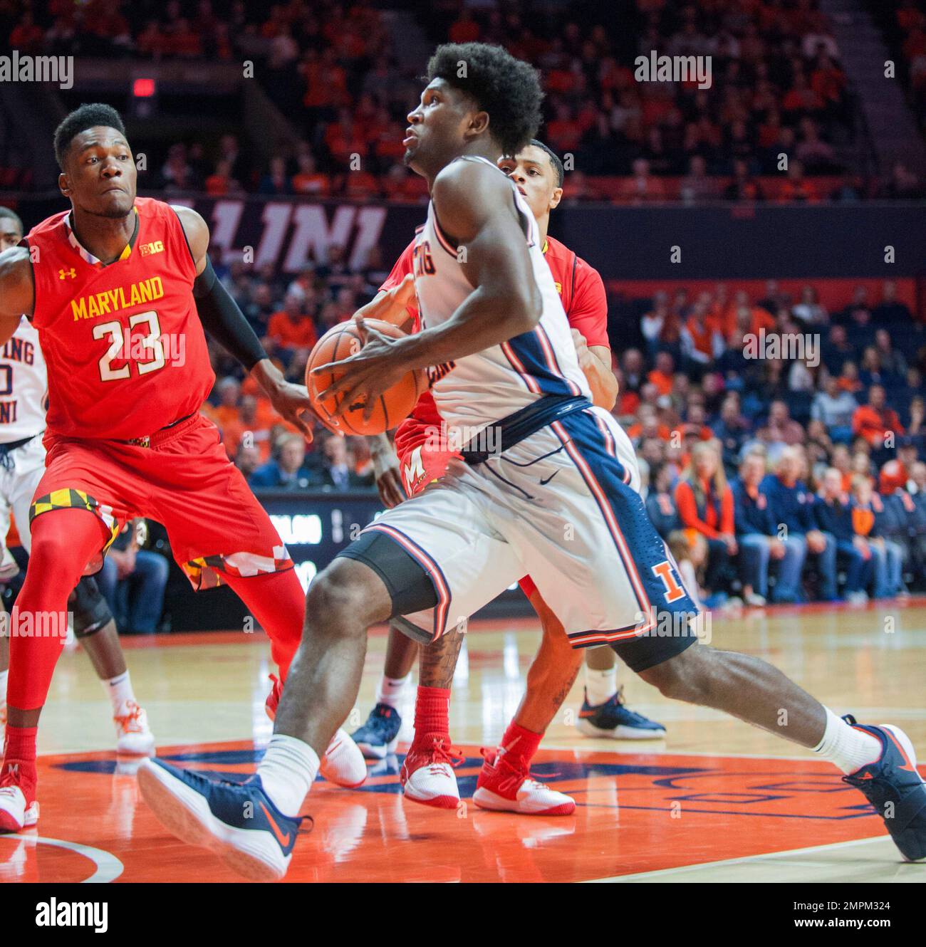 Illinois forward Kipper Nichols drives asMaryland forward Bruno ...
