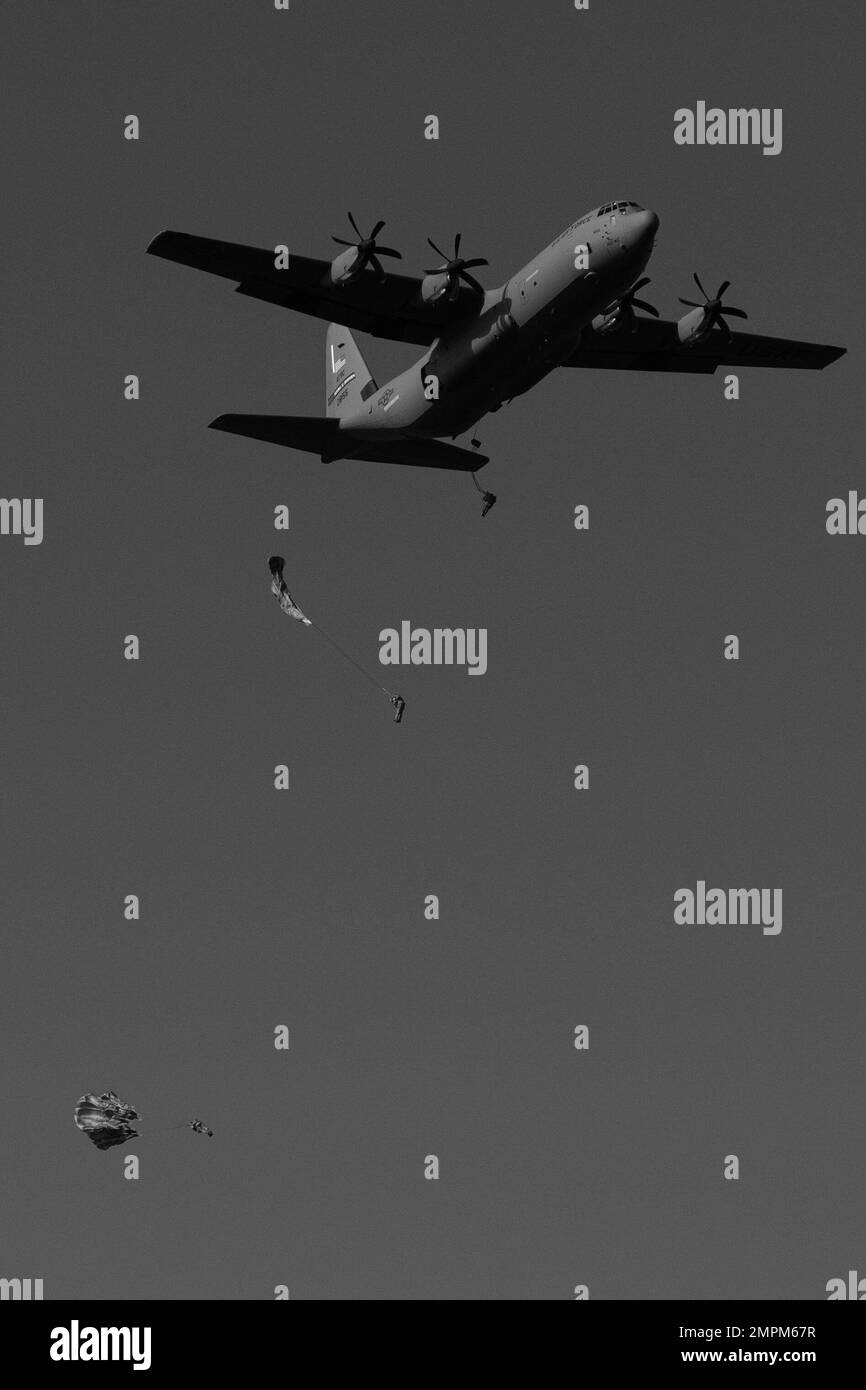 Members assigned to joint special operations forces jump out of a C ...