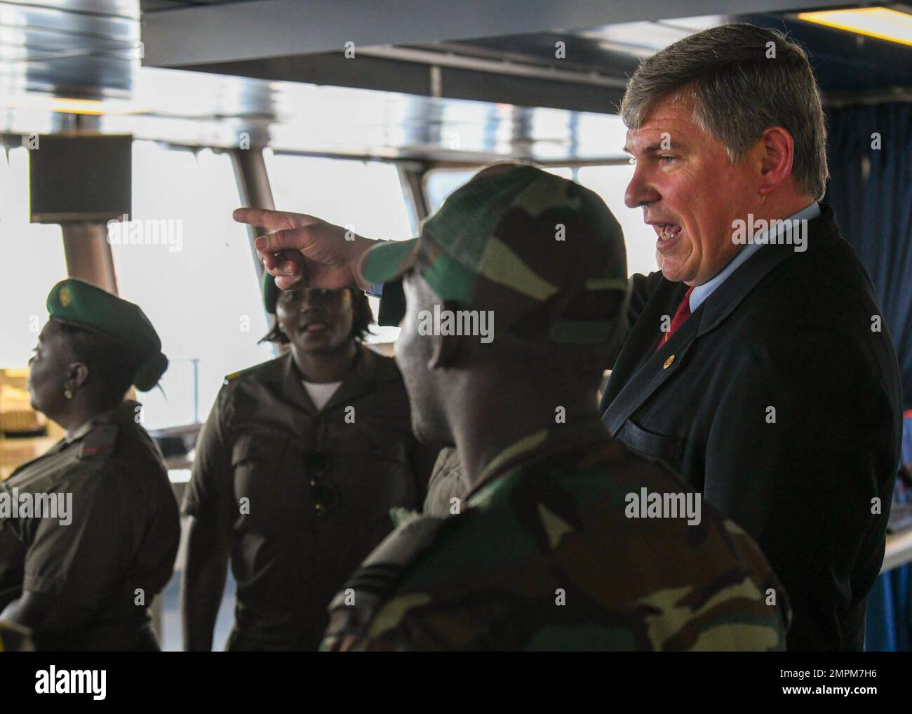 LUANDA, Angola (Nov. 3, 2022) Mr. Joseph Darlak, right, ship’s master ...