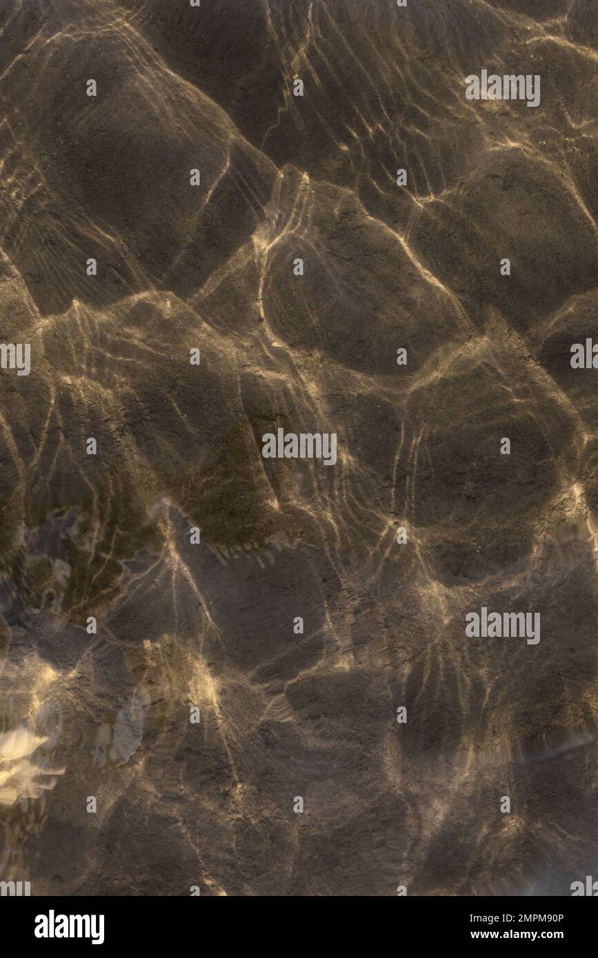 Abstract photo of the glow of the surface of transparent water with the ...