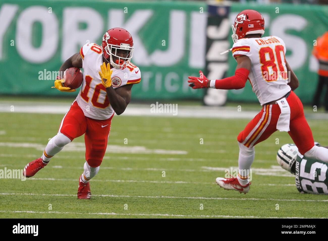 Kansas City Chiefs' Tyreek Hill, left, runs the ball during the first ...