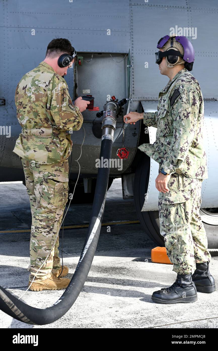 A 41st Airlift Squadron Airman and a sailor from Joint Base Pearl ...