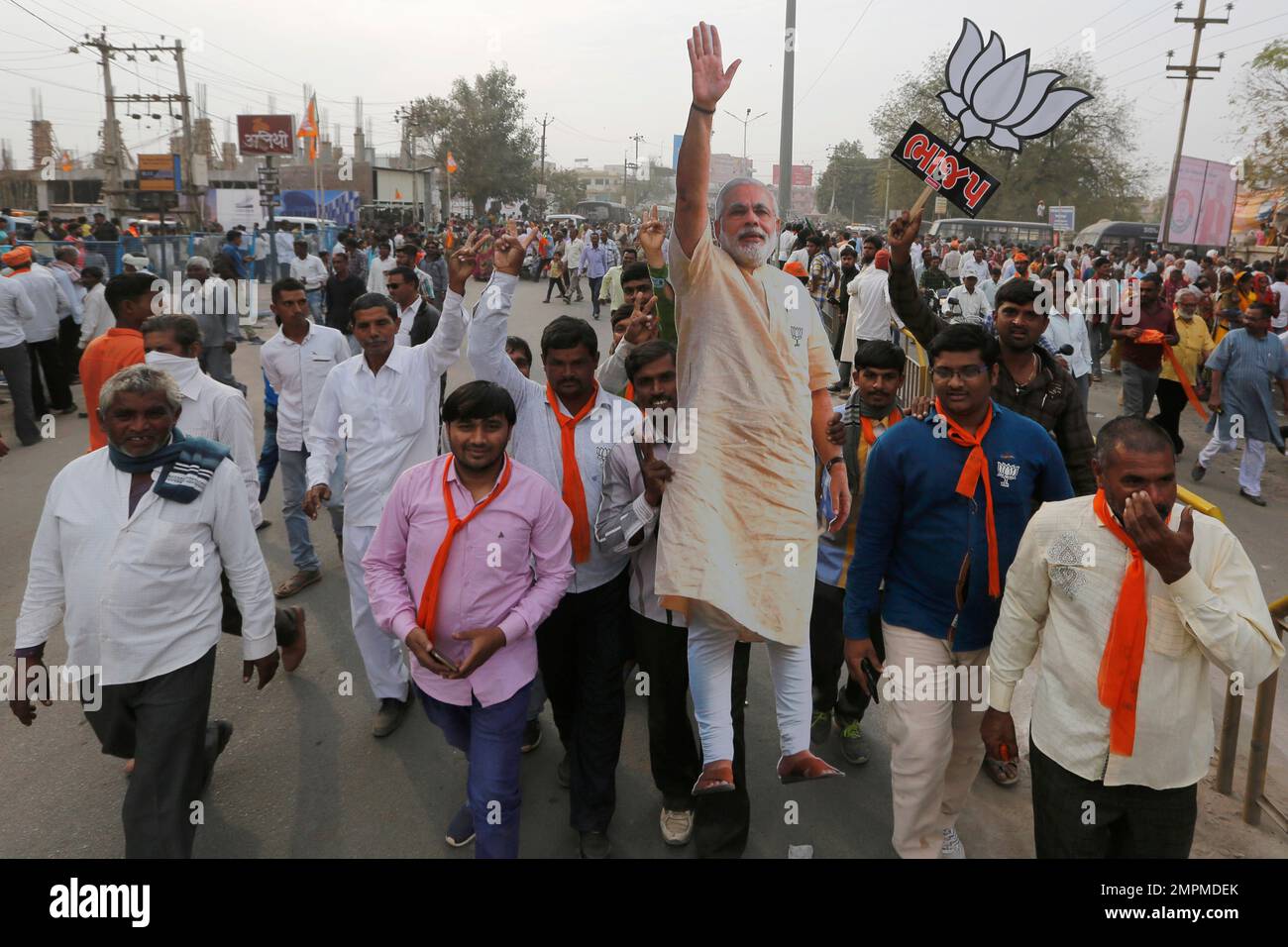 Supporters of India's ruling Bharatiya Janata Party(BJP) carry a cut ...